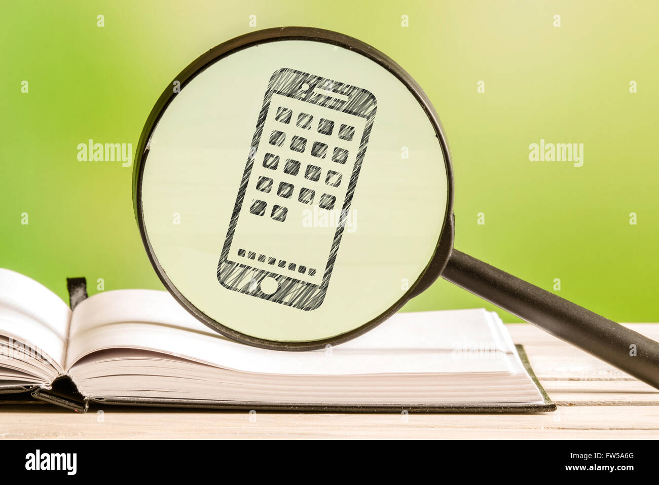 Smartphone search with a pencil drawing of a phone in a magnifying ...