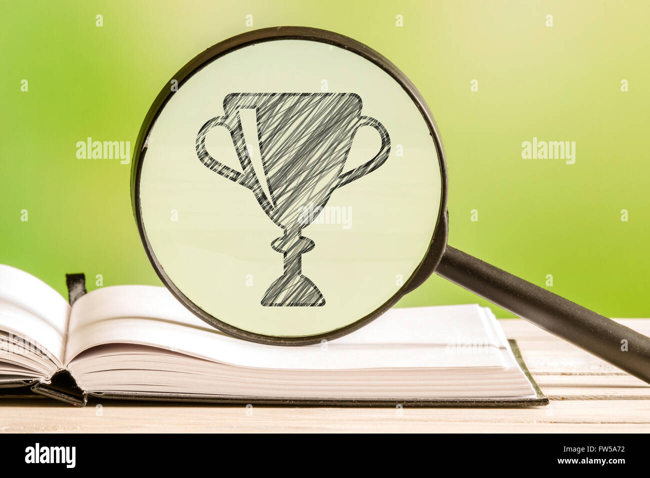 Winner statistics with a pencil drawing of a trophy in a magnifying ...