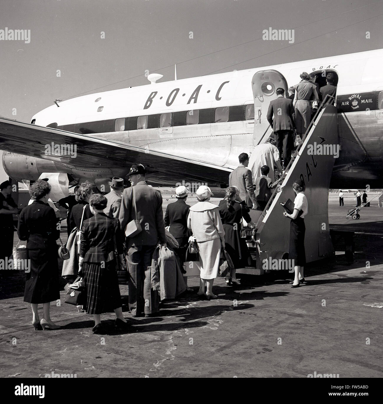 1950s historical, passengers boarding a B.O.A.C aircraft at London ...