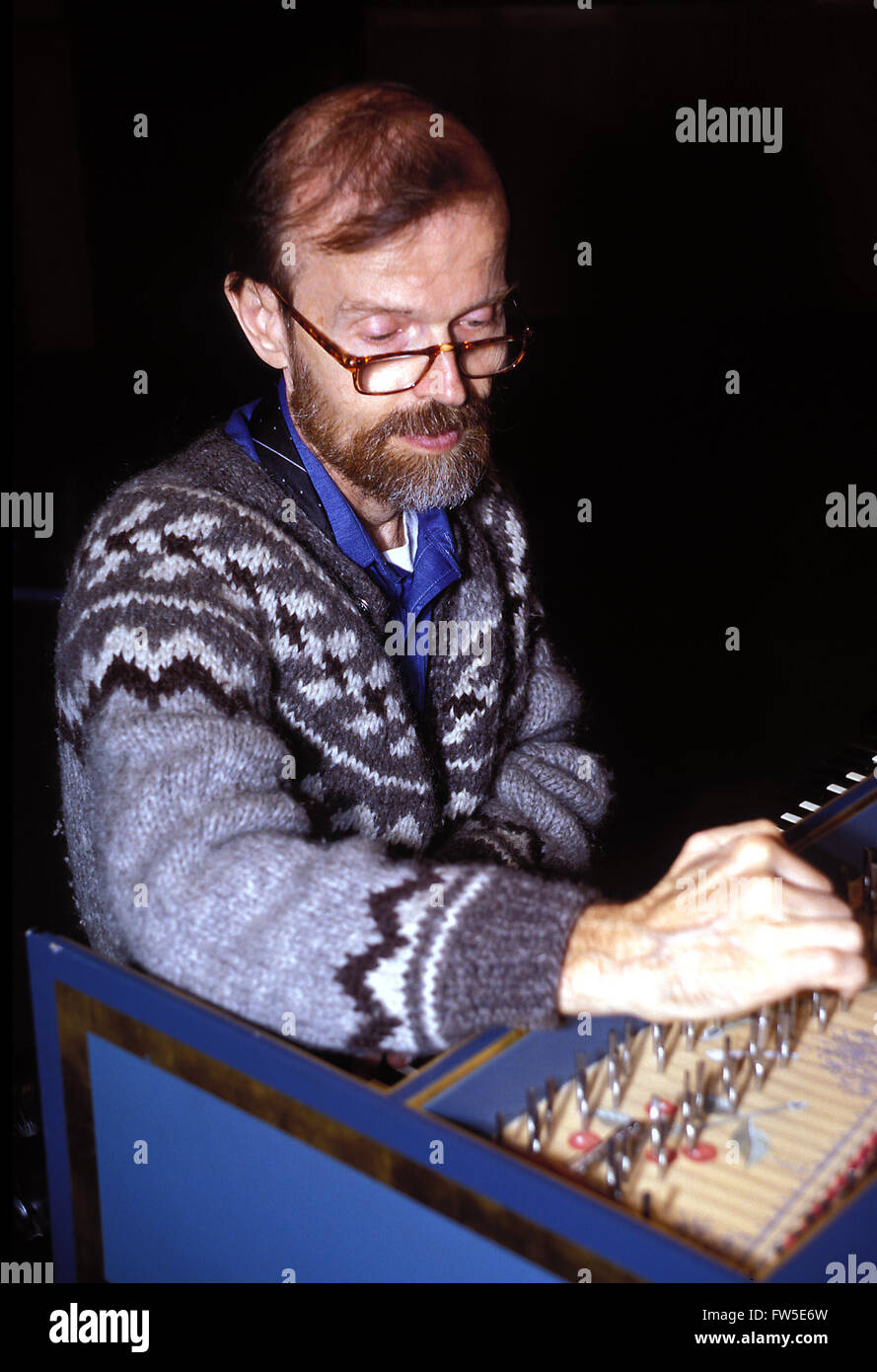 INSTRUMENTS - KEYBOARD - TUNER HARPSICHORD Tuner at work Stock Photo ...