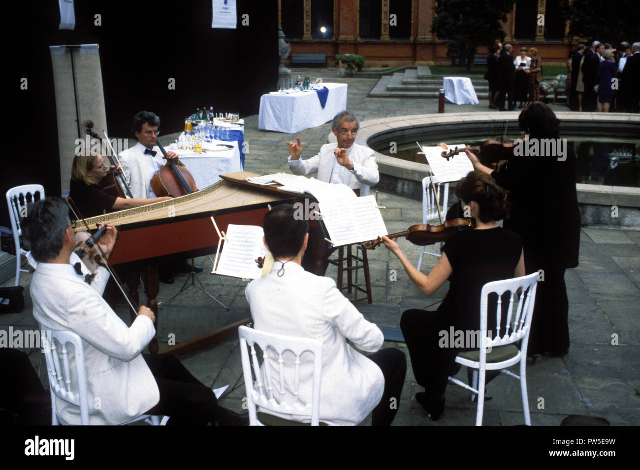 Chamber Orchestra performing at Courtyard Reception. Ensemble / concord ...