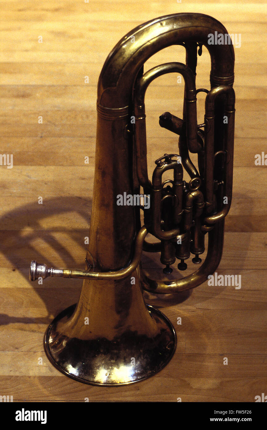 Tenor tuba standing on wooden floor Stock Photo - Alamy