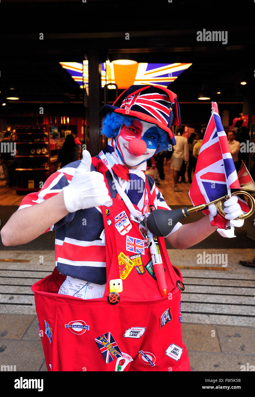 clown in British Union Jack flag dungarees and cap, with painted nose ...
