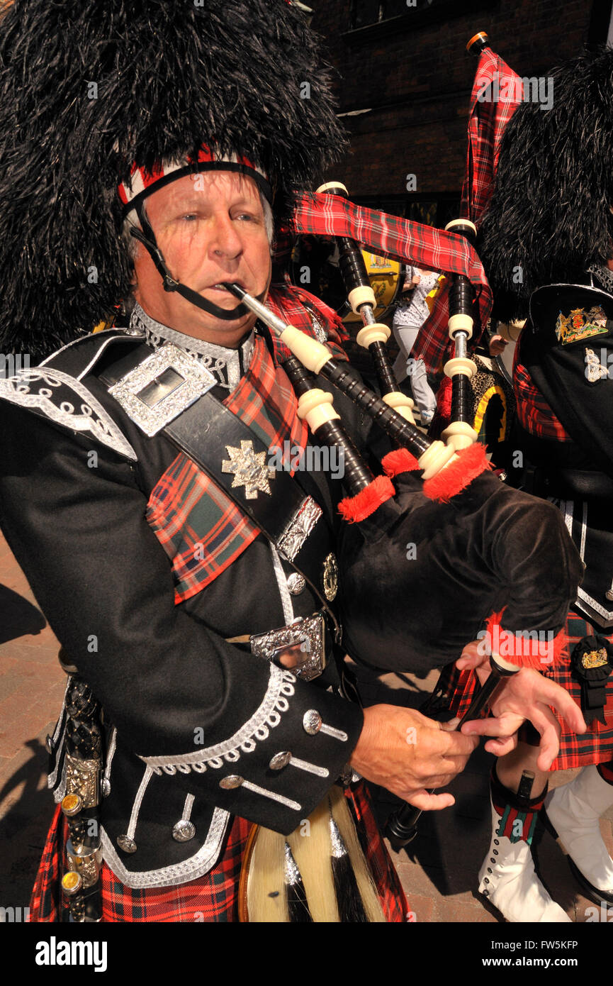 bagpiper in Scottish tartan uniform, in marching band, during Rochester ...