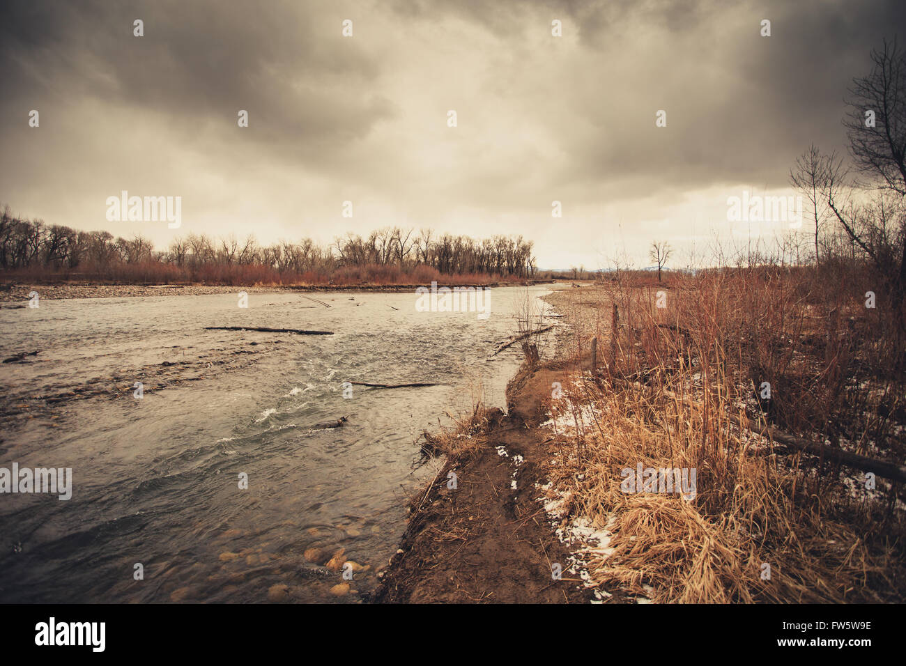 River landscape with flowing water, clouds, and trees Stock Photo - Alamy