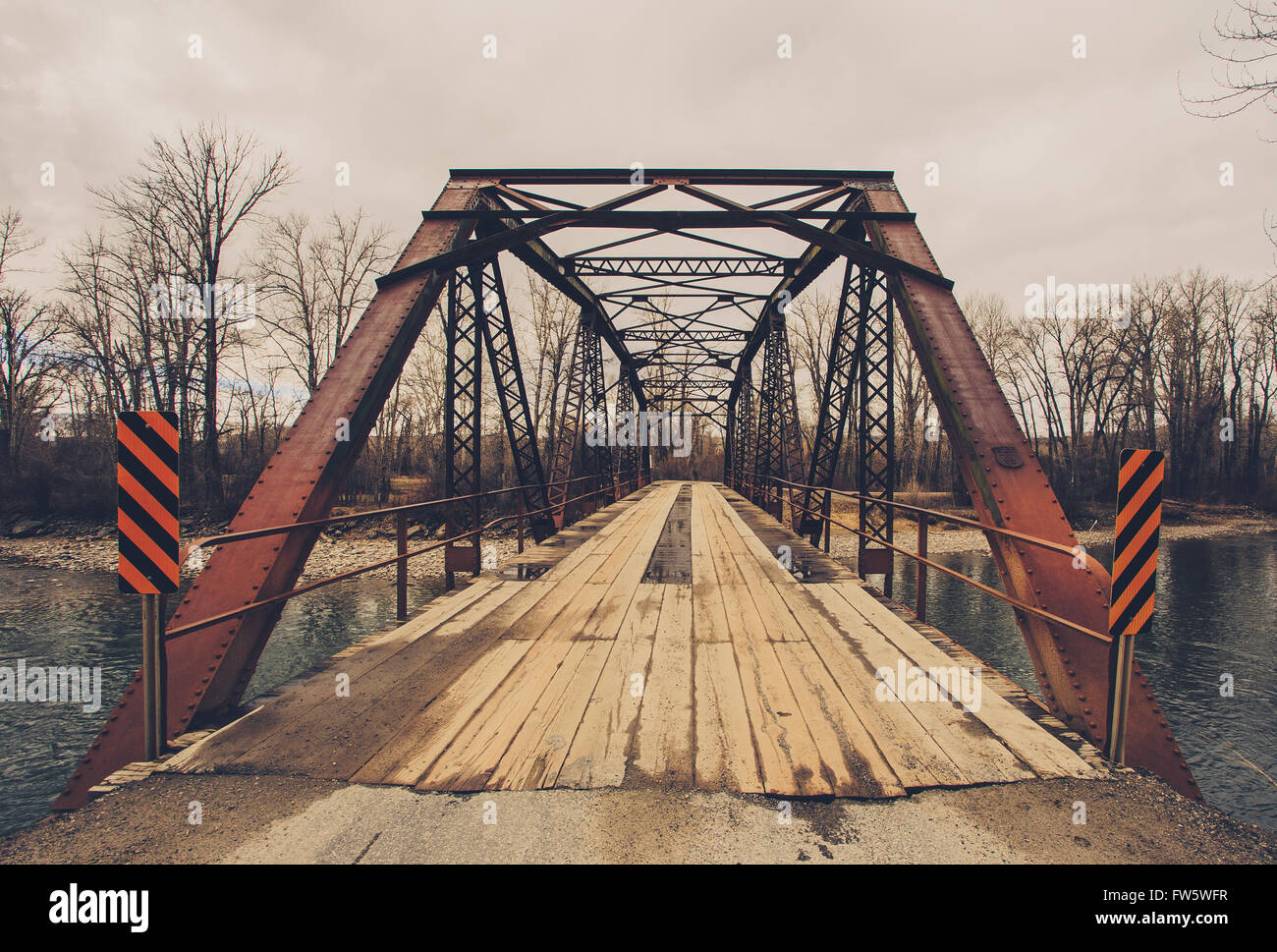 Old vintage trestle bridge across the river Stock Photo - Alamy