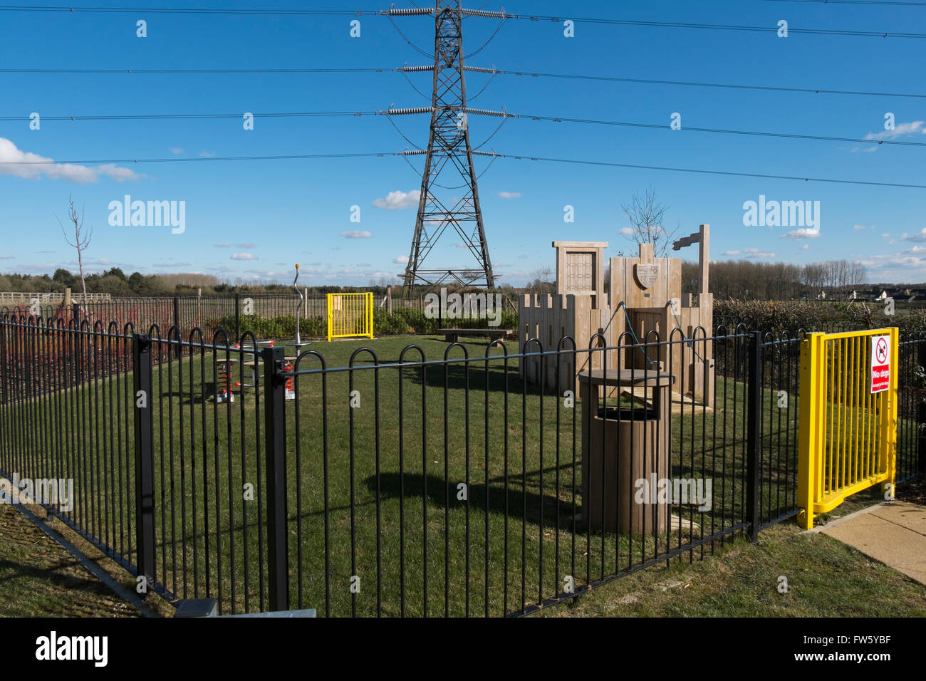 Electricity pylon next to a new housing development on the outskirts of ...