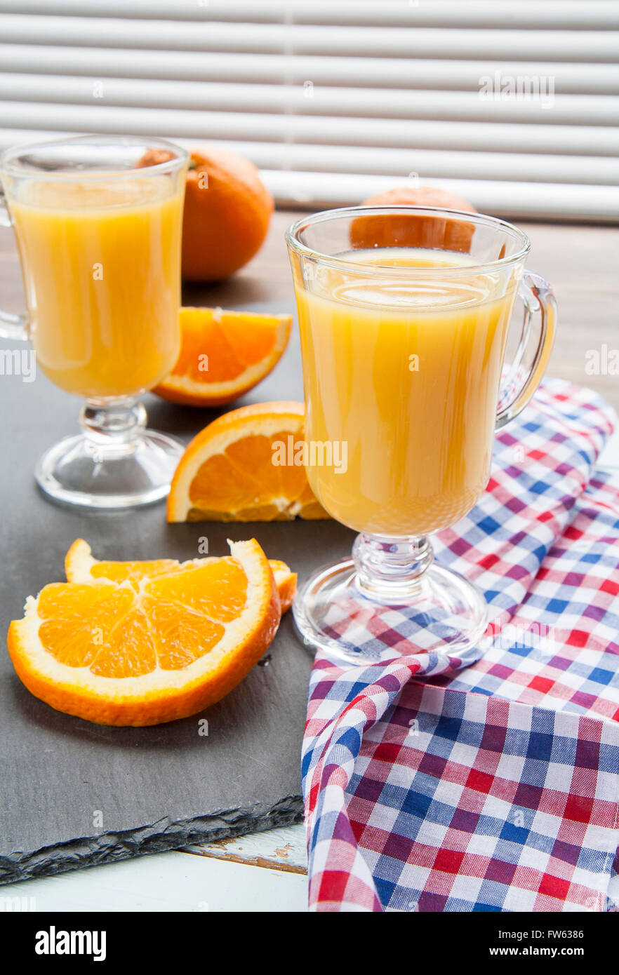 Natural and fresh orange juice in glass cup with fresh orange Stock ...