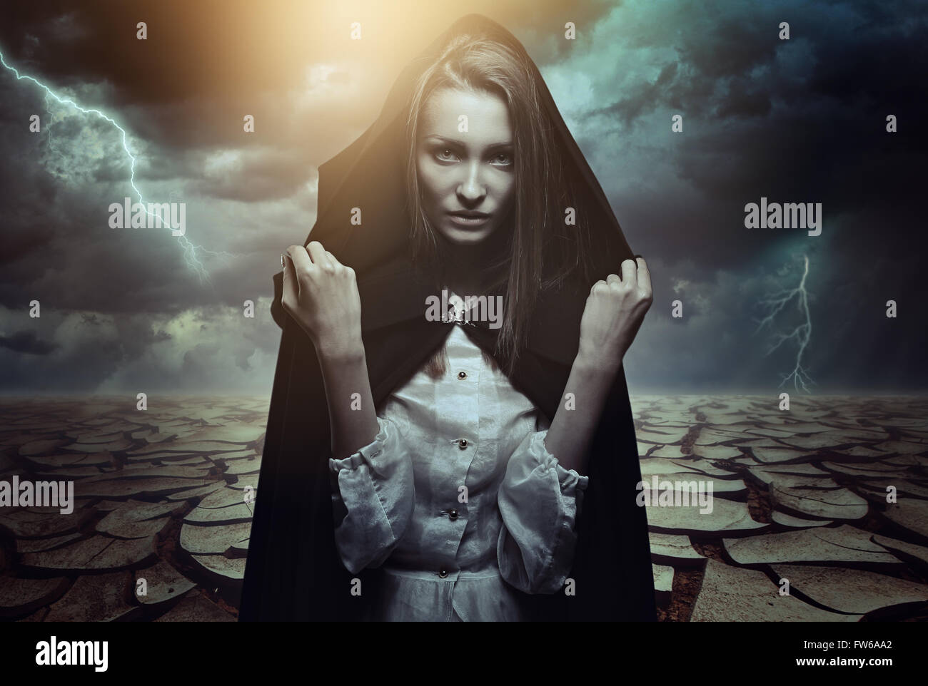 Mysterious beautiful woman in a desert landscape. Fantasy and surreal ...