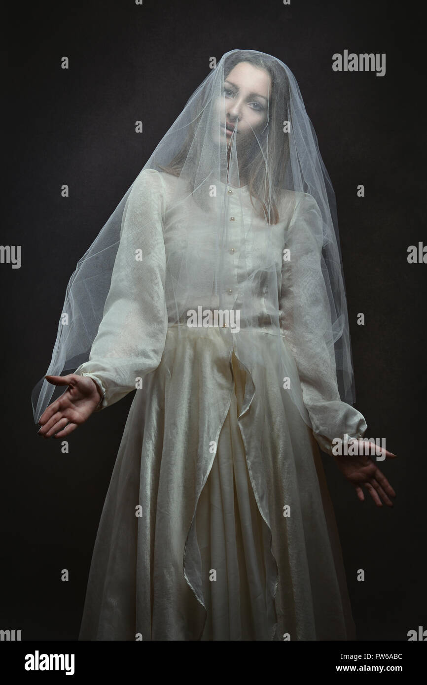 Pale beautiful woman posing like a puppet . Surreal and dark Stock ...