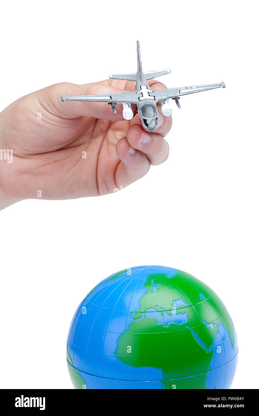 Human hand holding a fighter plane aiming at a globe Stock Photo - Alamy