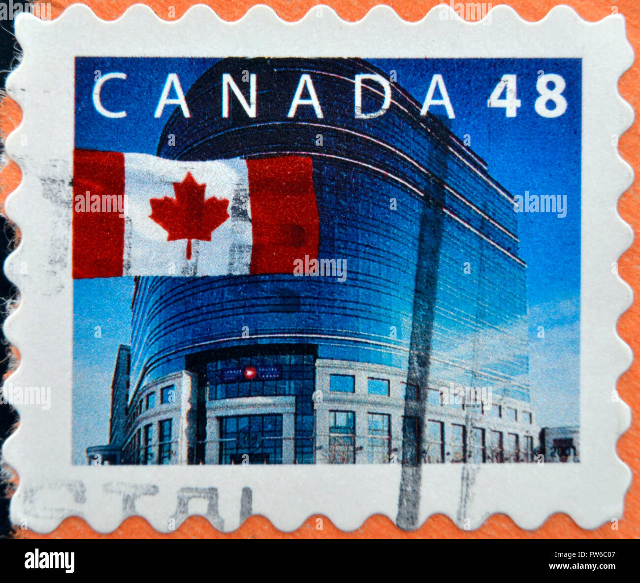 CANADA-CIRCA 2002: A stamp printed in Canada shows the national flag of ...