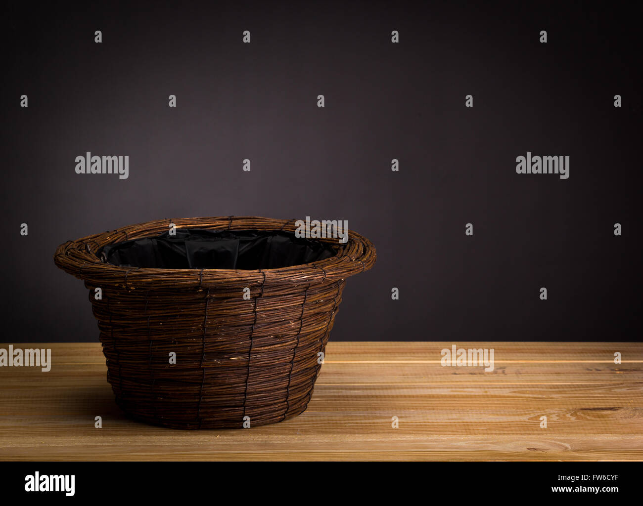 Empty basket on table with black background. Ideal for product display ...