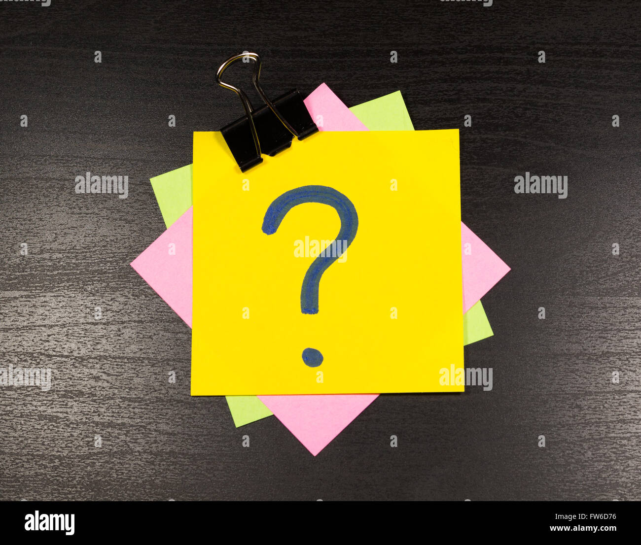 question mark on a sticky note on wooden background Stock Photo - Alamy