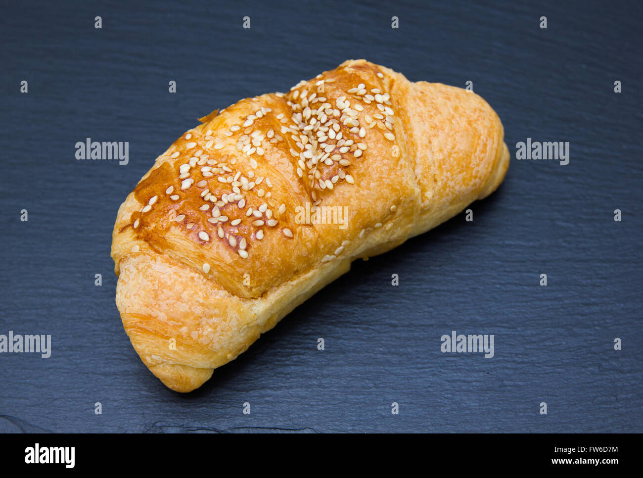 salty croissant with sesame on a slate floor Stock Photo - Alamy
