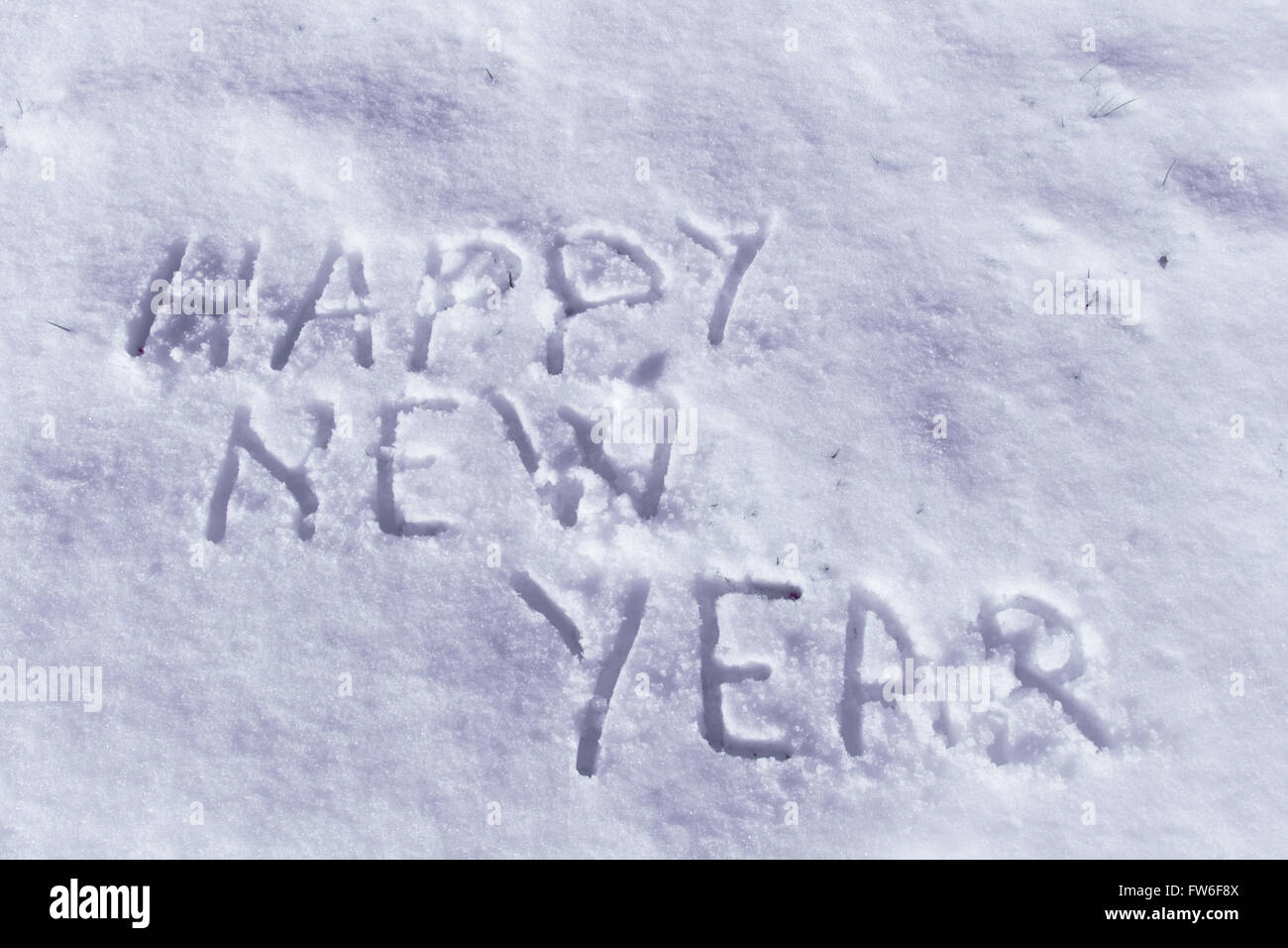 Happy New Year message on a snow field Stock Photo - Alamy