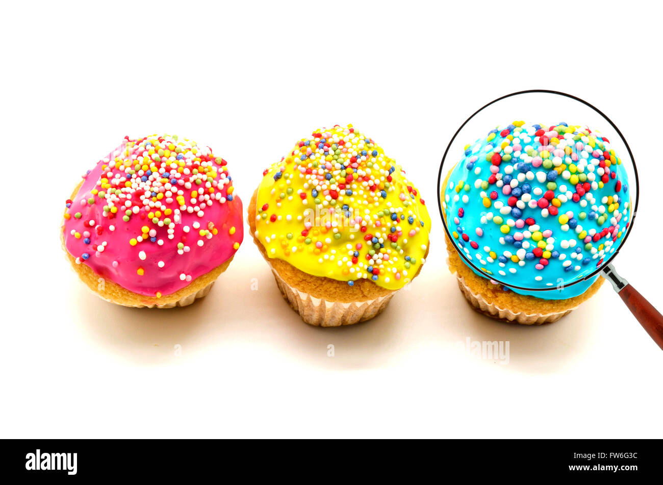 blue cupcake view through magnifying glass Stock Photo - Alamy