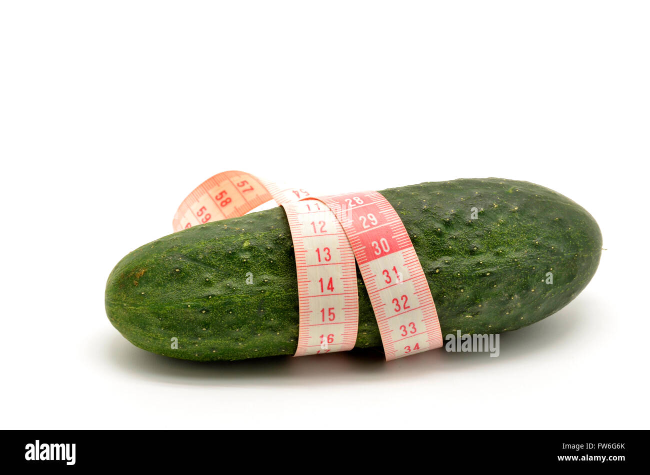 Cucumber and measuring tape isolated on white Stock Photo - Alamy