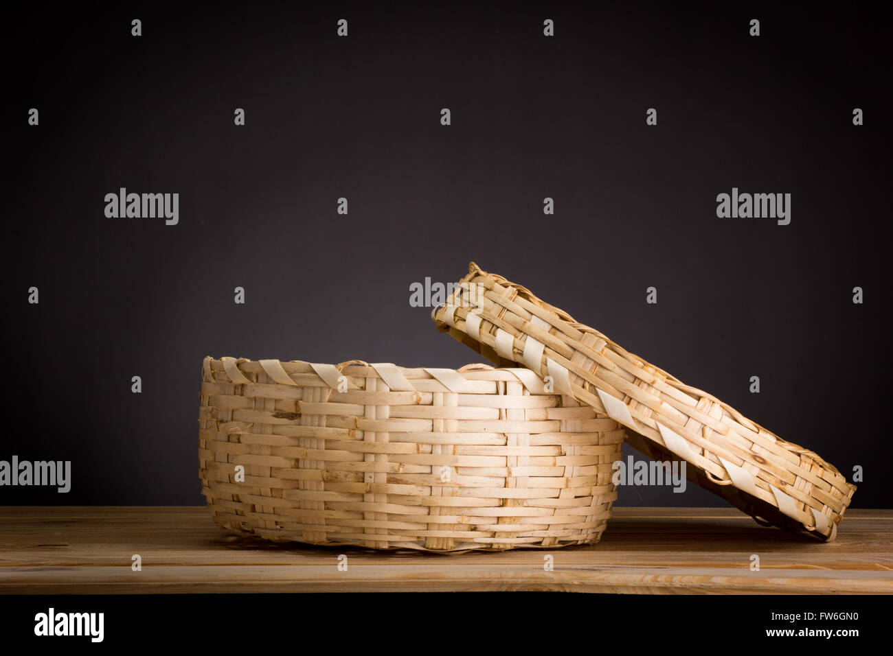 Empty basket on table with black background. Ideal for product display ...