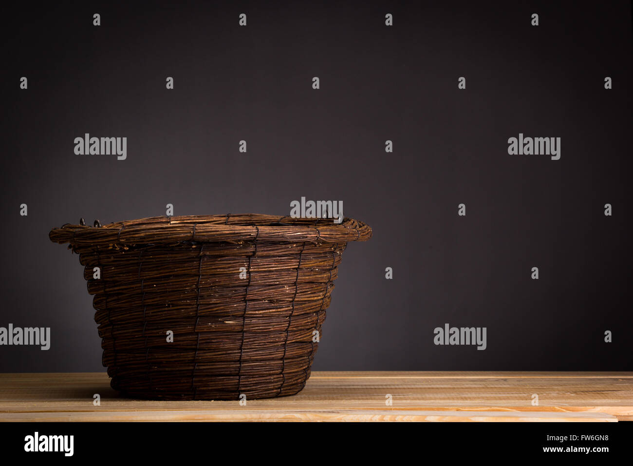 Empty basket on table with black background. Ideal for product display ...