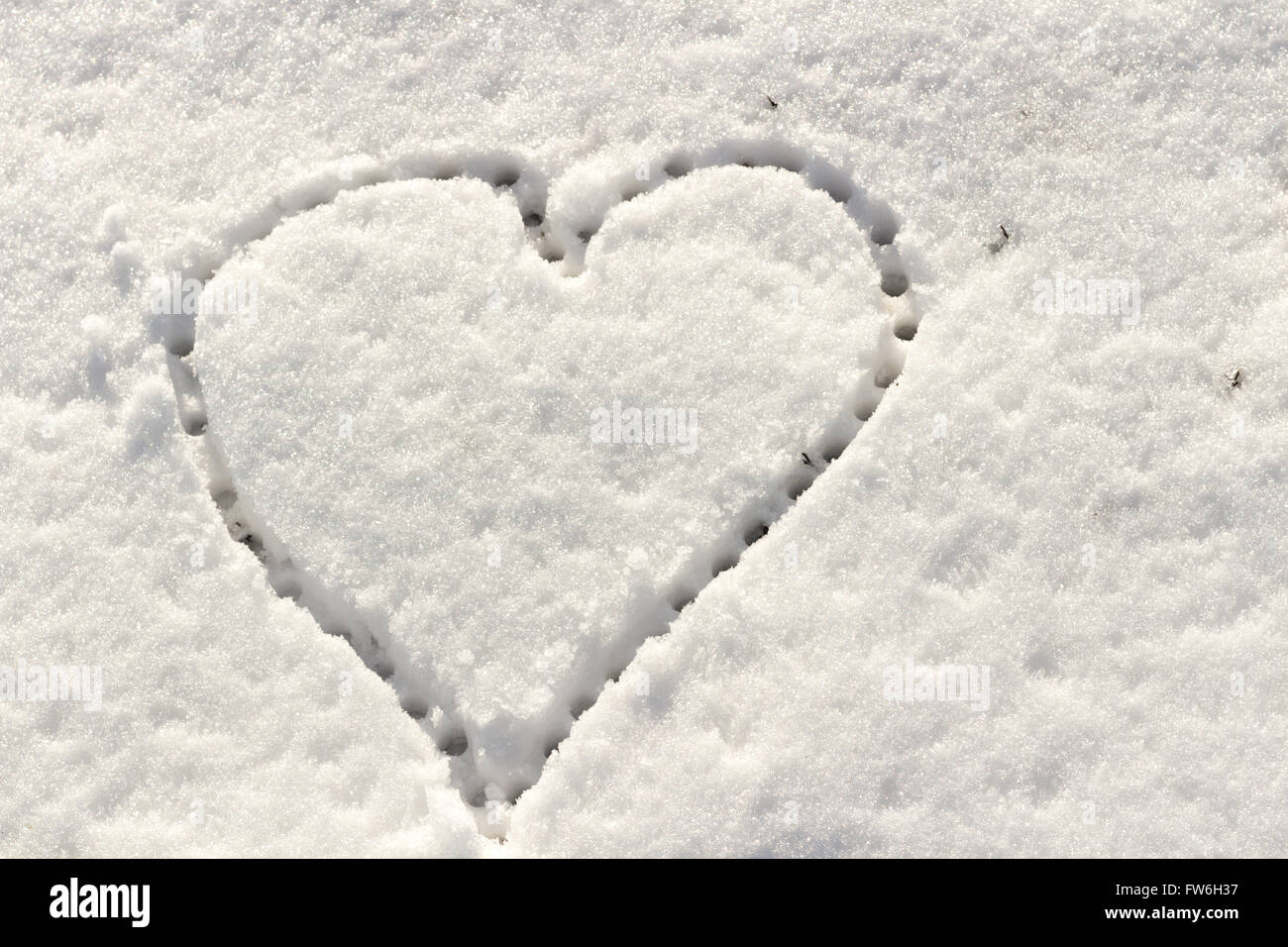 Snow with drown heart shape Stock Photo - Alamy