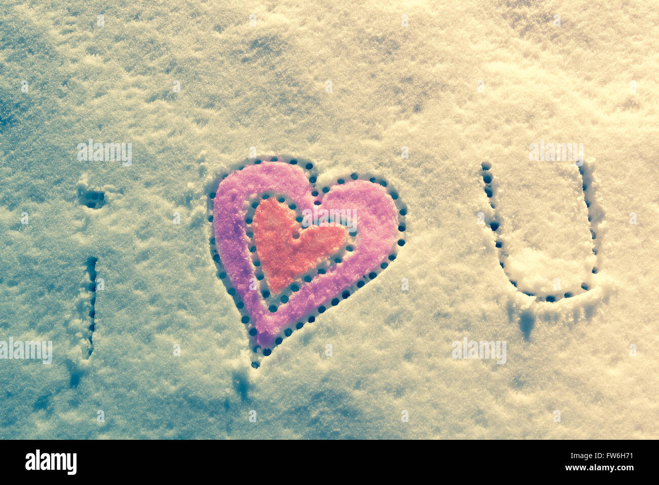 I love you with heart sign writing on the snow Stock Photo - Alamy