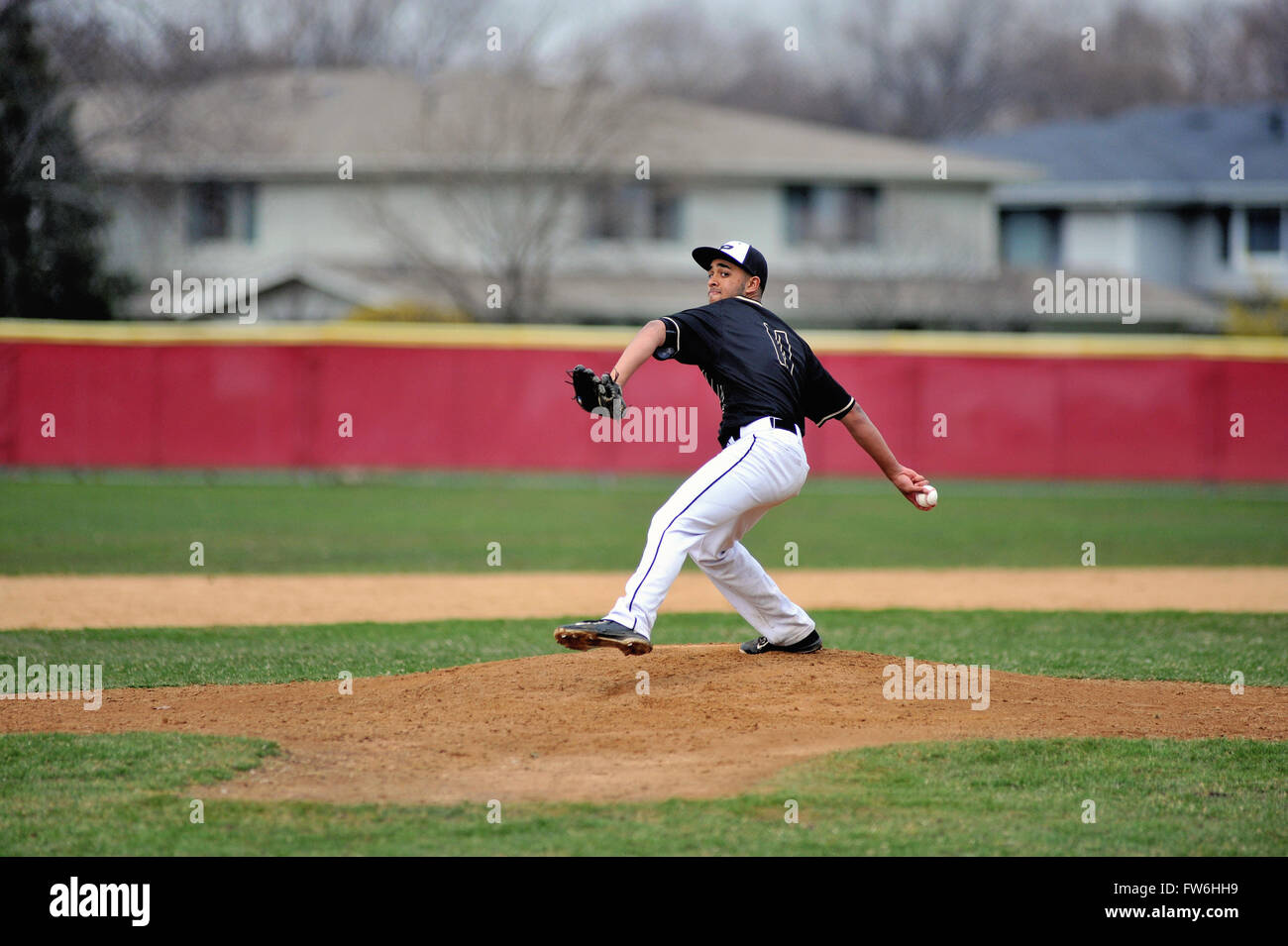 In the middle of his wind up and delivery a pitcher stays focused on ...