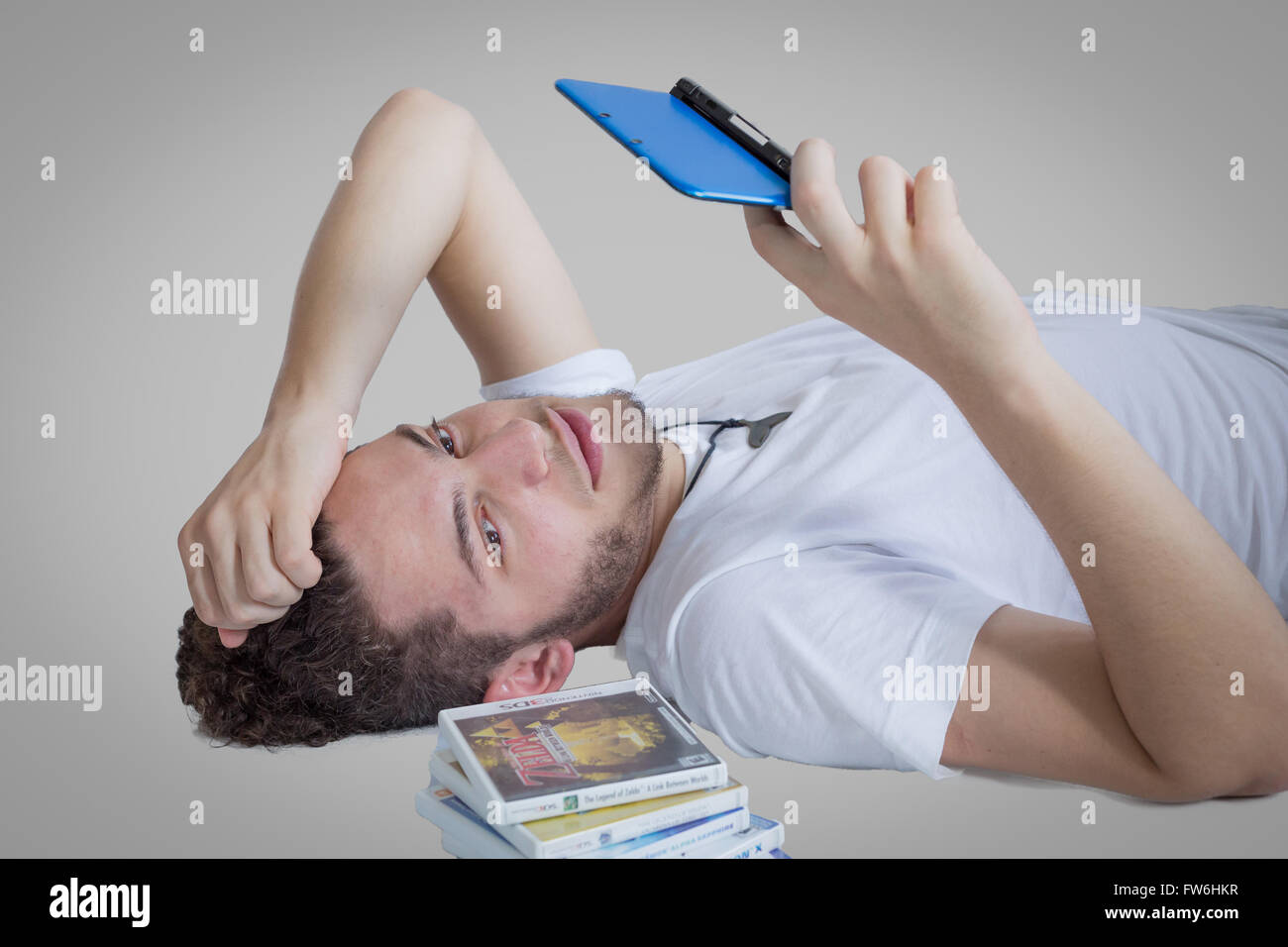 Man playing with his DS Stock Photo - Alamy