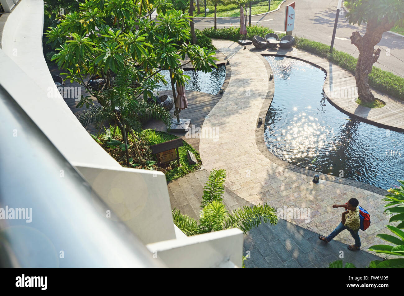 A walk path and fish pond in the park Stock Photo - Alamy