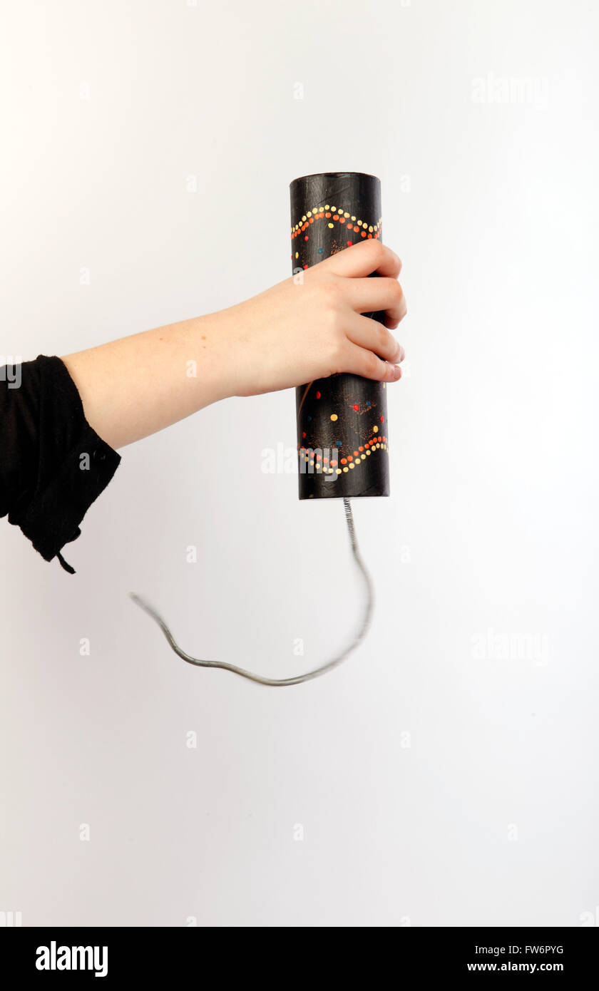 Thunder drum or spring drum being played by a percussionist. Small tube ...