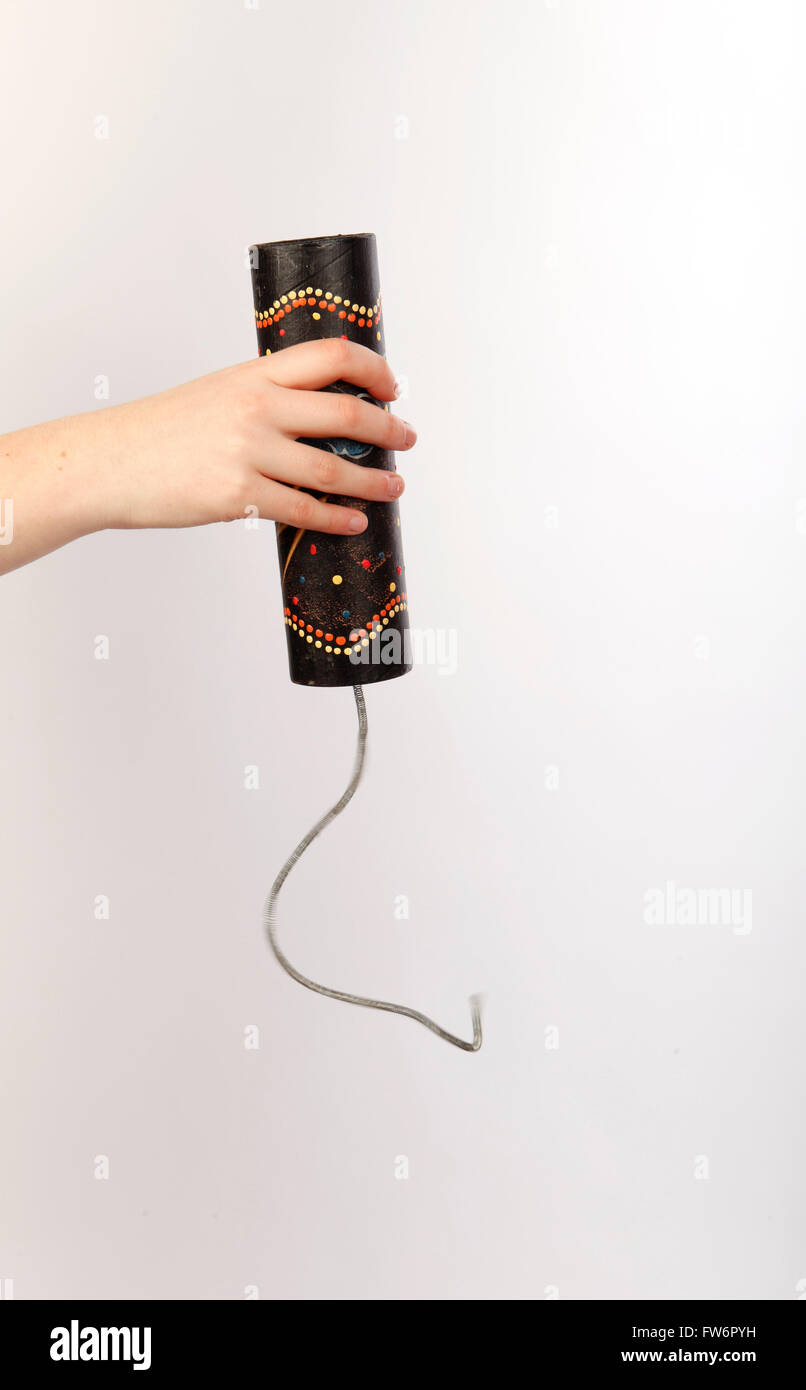 Thunder drum or spring drum being played by a percussionist. Small tube ...