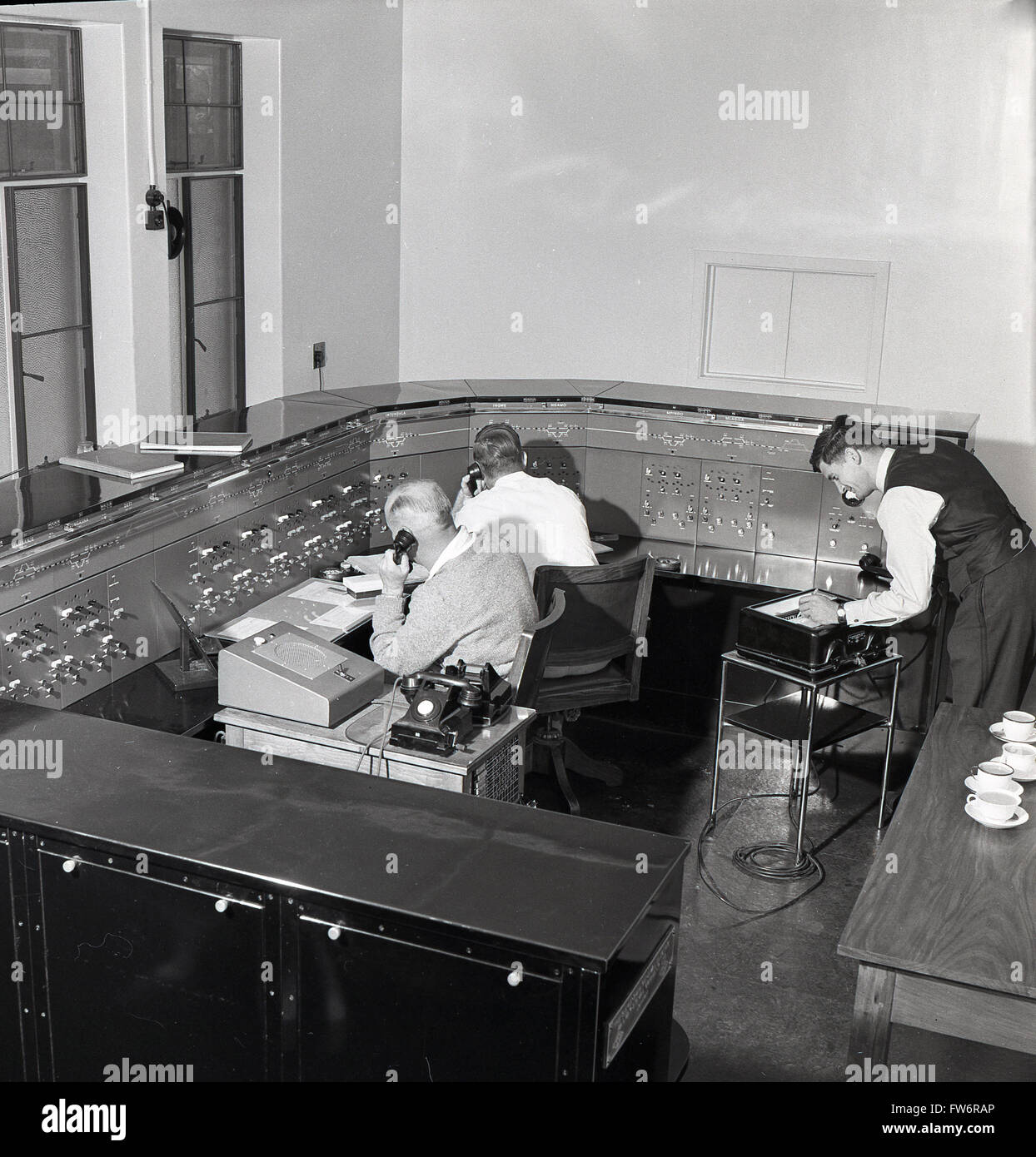 1950s historical, working in a control room at airport Jan Smuts, South ...
