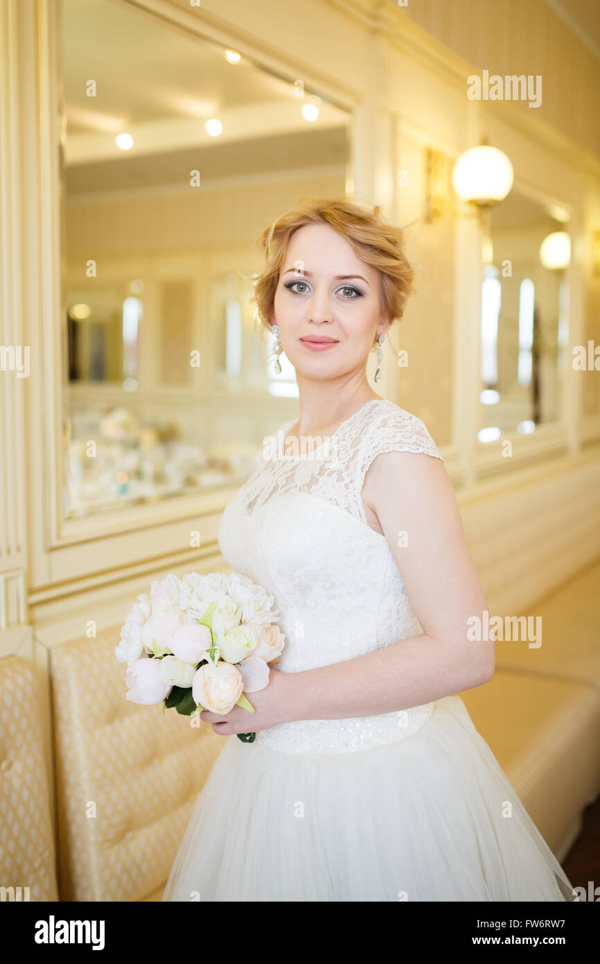 Portrait of the beautiful bride in a bright room Stock Photo - Alamy