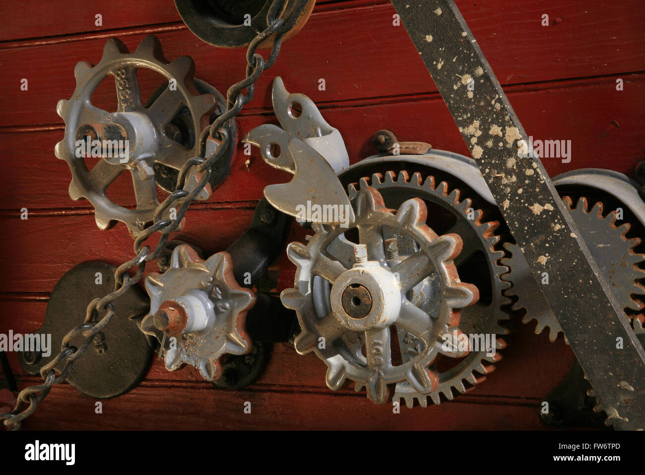 Metal cogs on a wooden surface Stock Photo - Alamy
