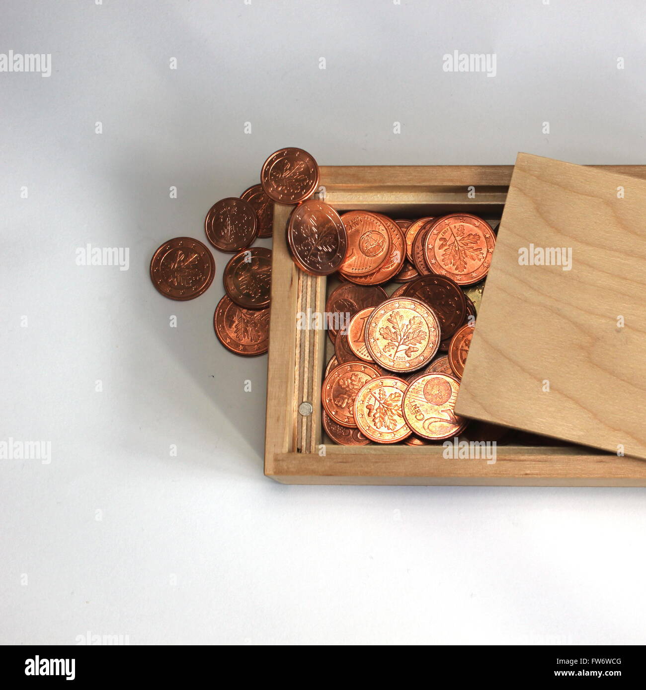 Wooden box with european coins Stock Photo - Alamy