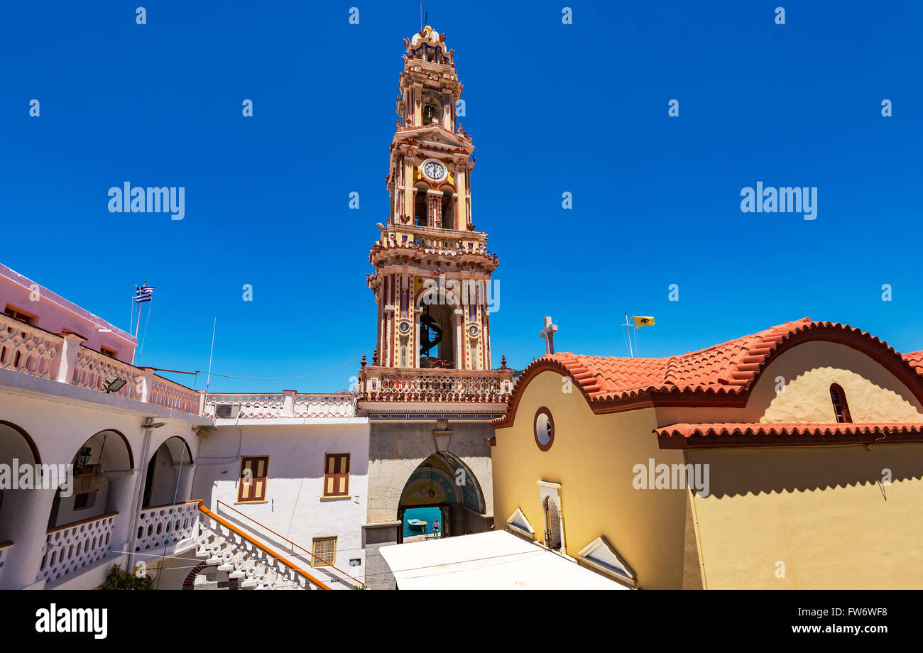 The belfry and church in Panormitis monastery on Symi island Greece ...