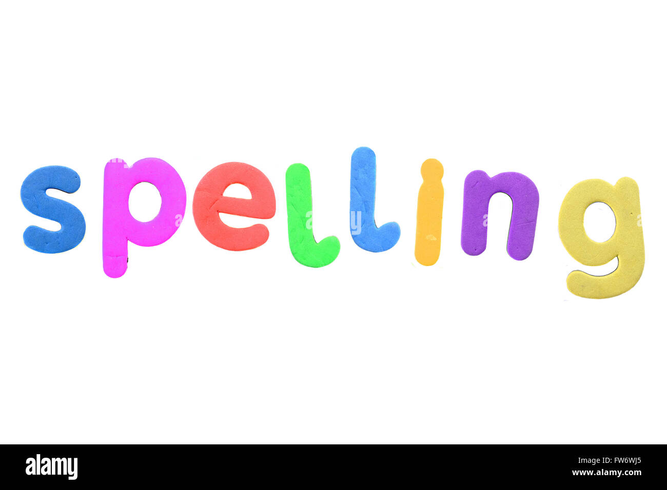 The word SPELLING created from fridge magnets against a white ...