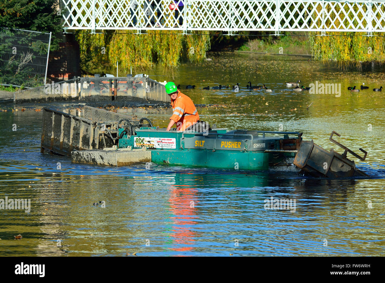 Silt Pusher boat being operated by man at Wardown Park, Luton ...