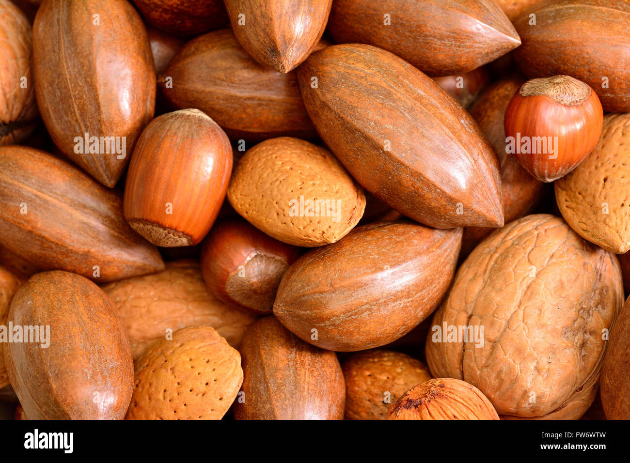 Mixed nuts background Stock Photo - Alamy