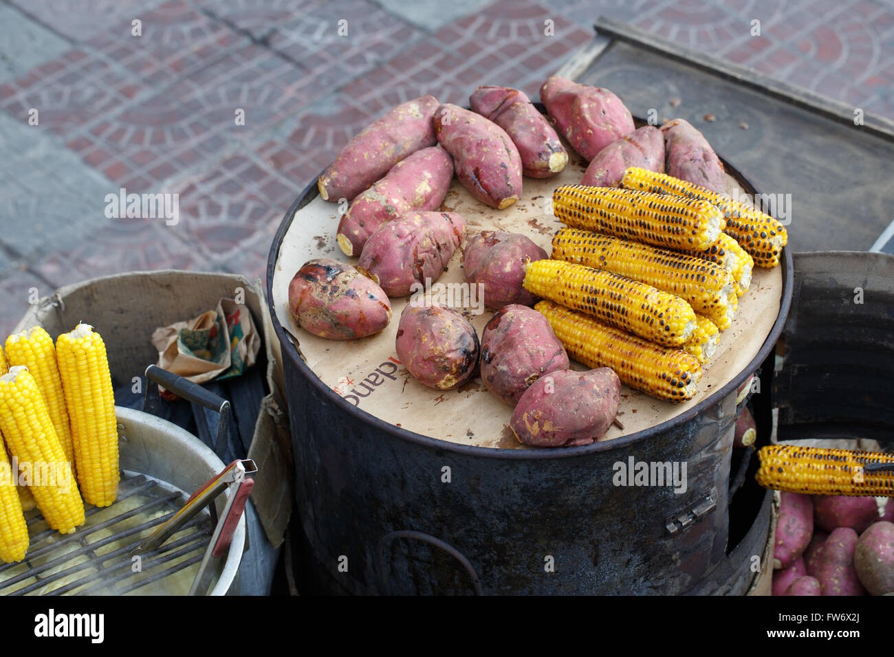 Roadside food stalls, baked sweet potato and corn Stock Photo - Alamy
