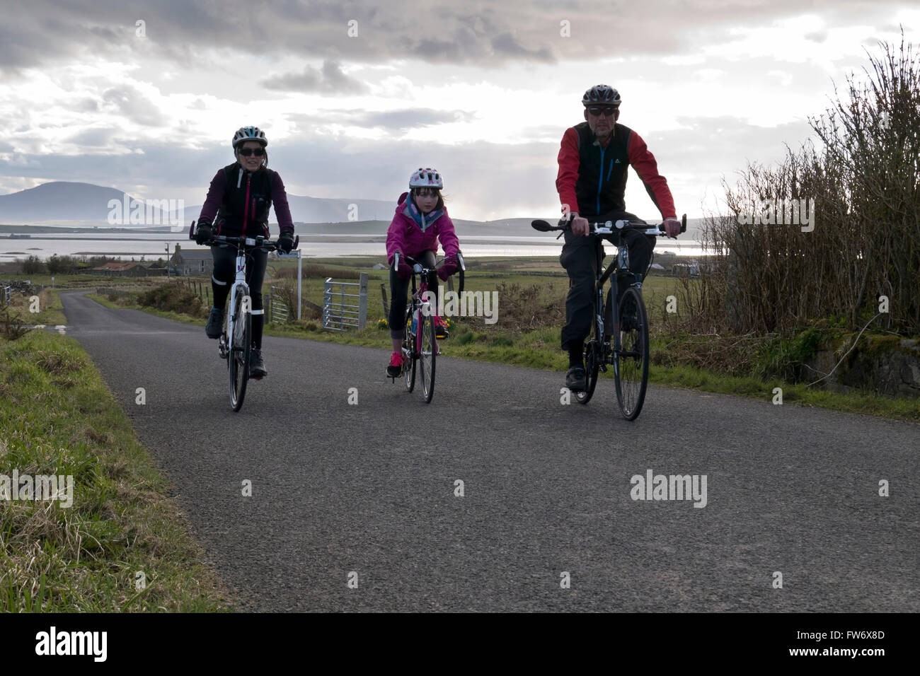 Man and child cycling together hi-res stock photography and images - Alamy