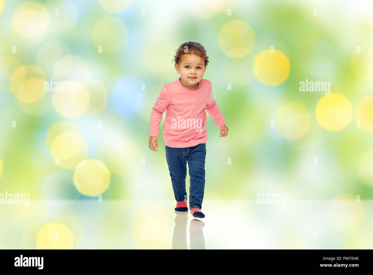 little african american baby girl walking Stock Photo - Alamy