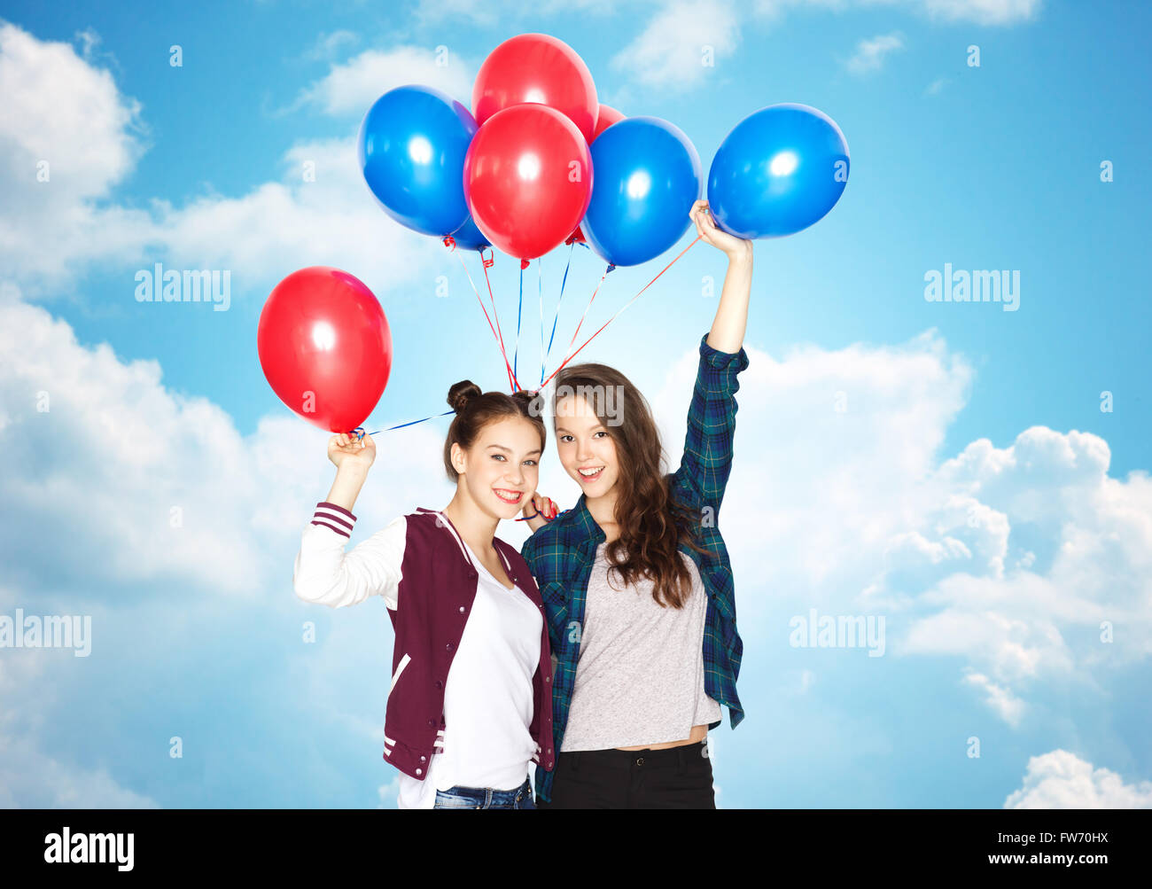 happy teenage girls with helium balloons Stock Photo - Alamy