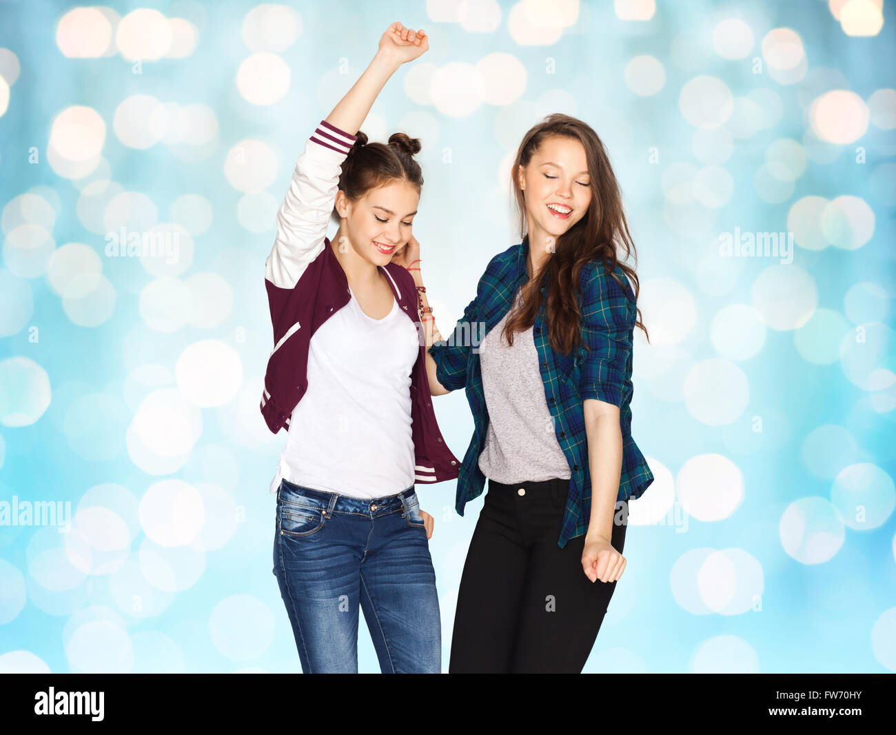 happy smiling pretty teenage girls dancing Stock Photo - Alamy