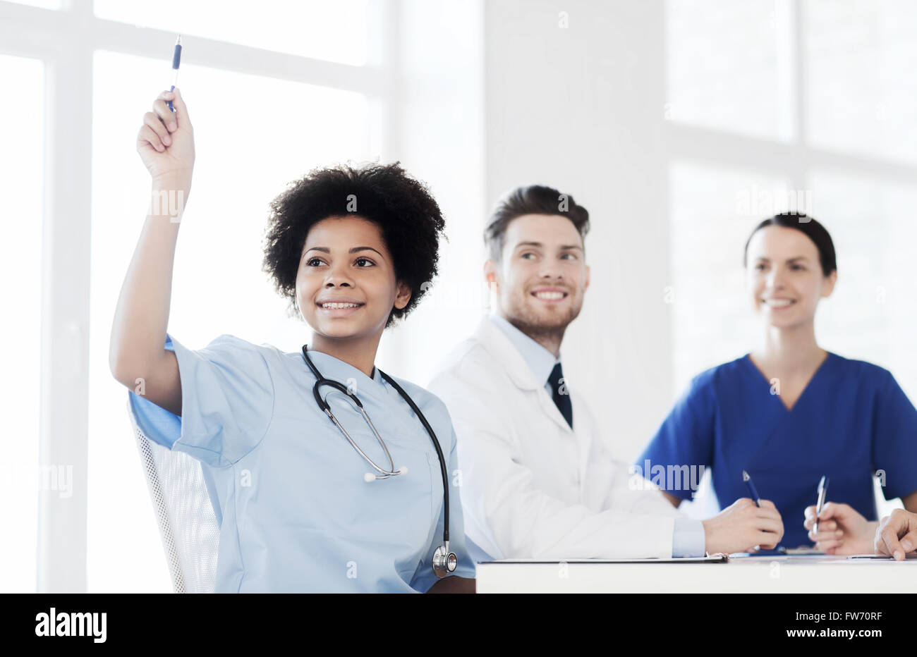 group of happy doctors on conference at hospital Stock Photo - Alamy