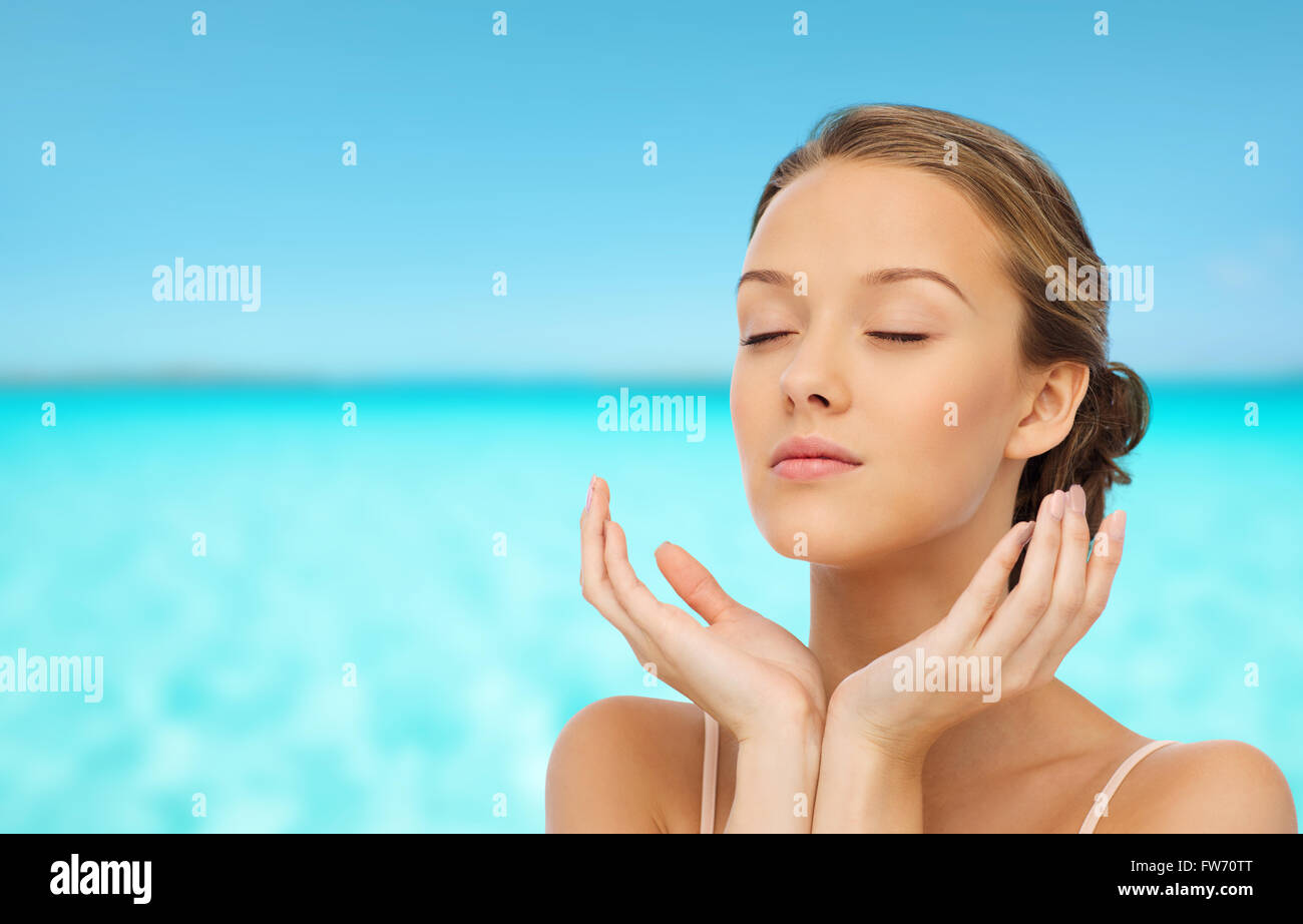 young woman face and hands Stock Photo - Alamy
