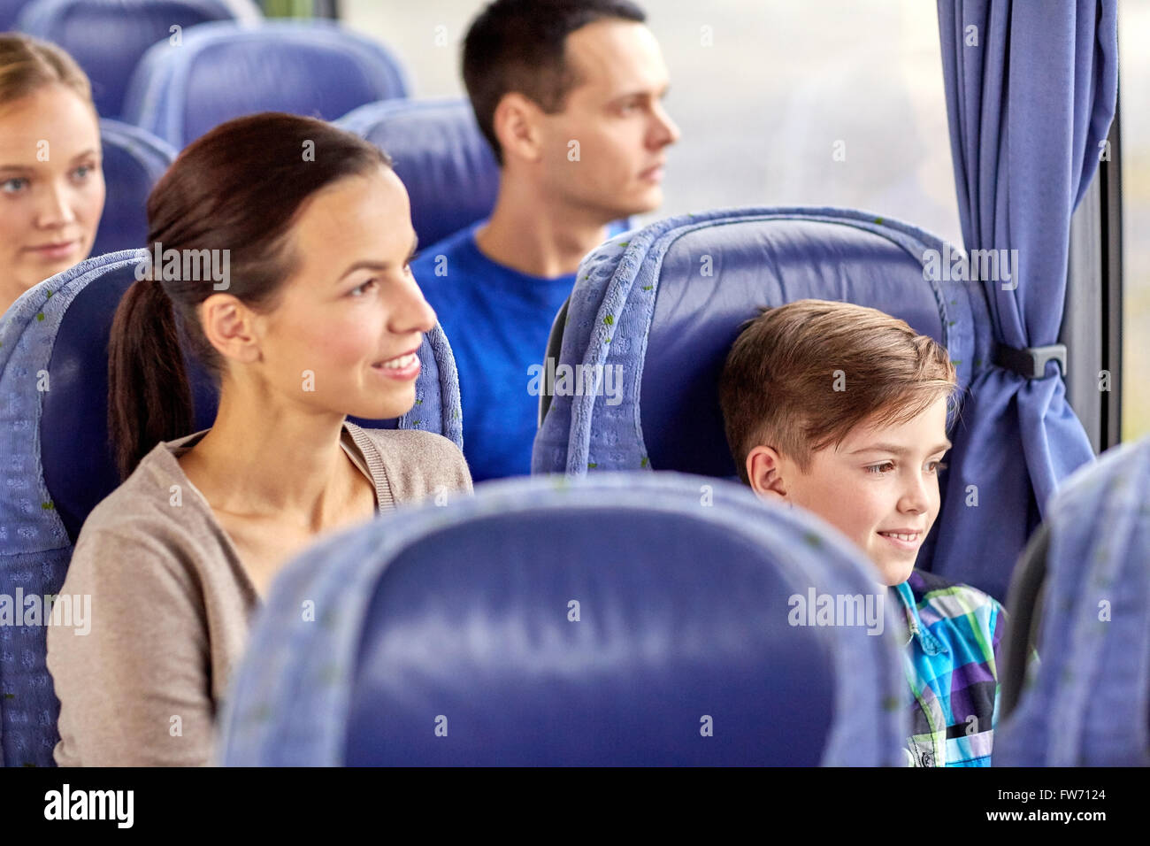 happy family riding in travel bus Stock Photo - Alamy