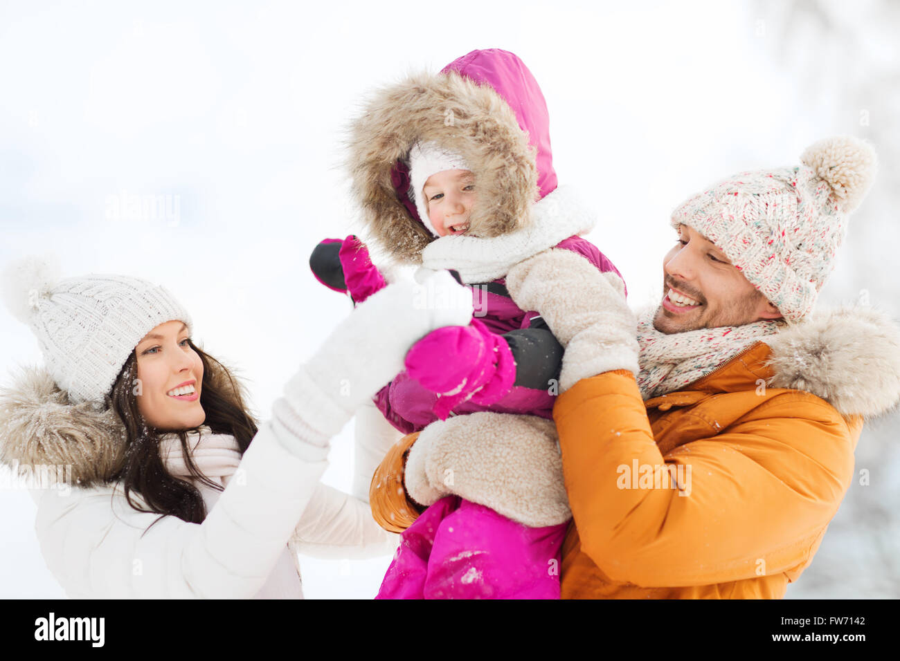 happy family with child in winter clothes outdoors Stock Photo - Alamy