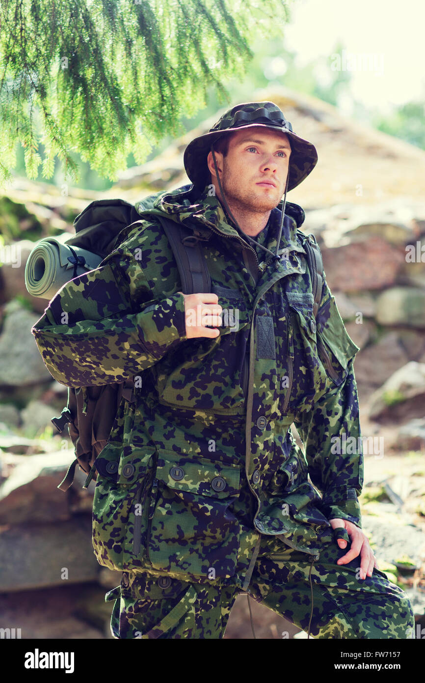 young soldier with backpack in forest Stock Photo - Alamy