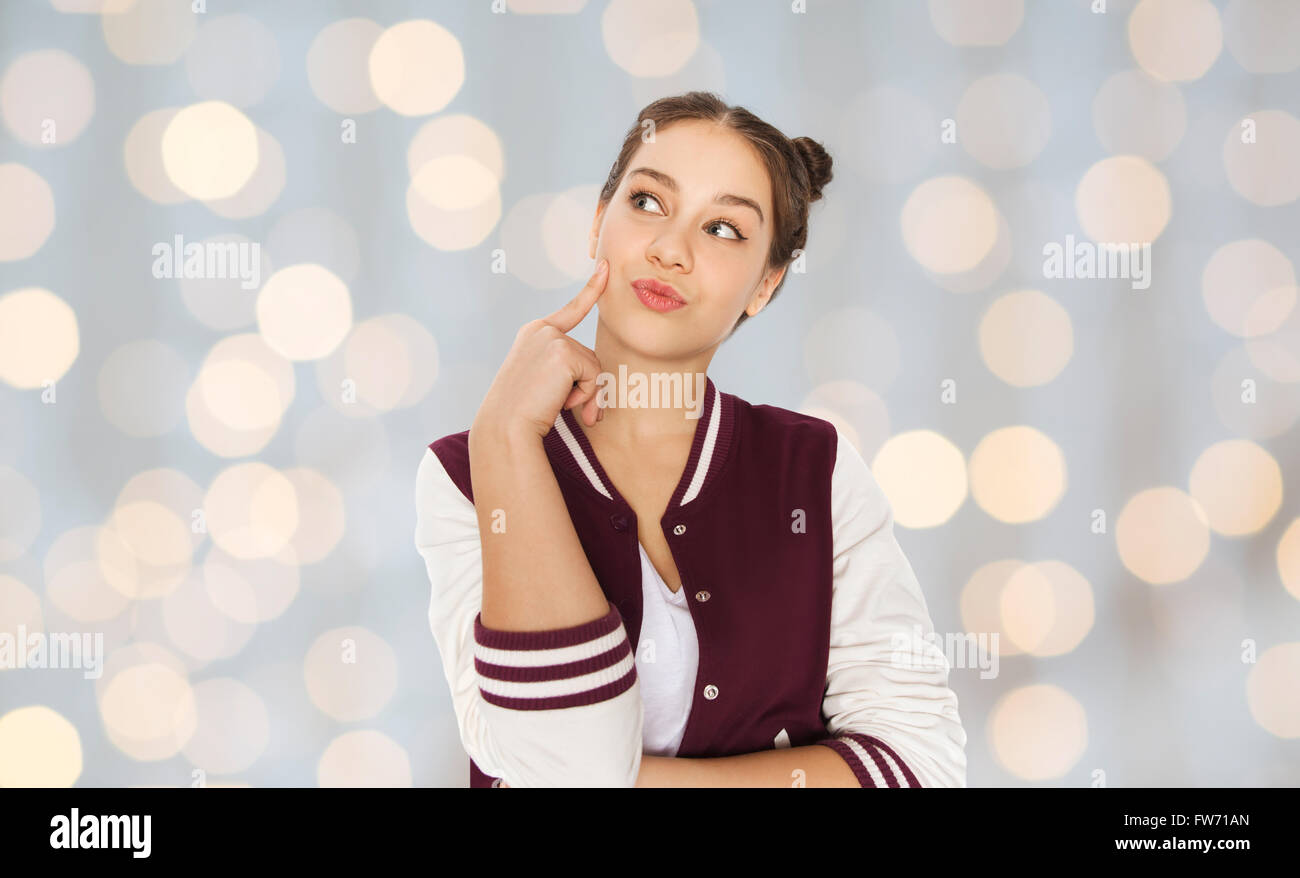 happy pretty teenage girl thinking Stock Photo - Alamy